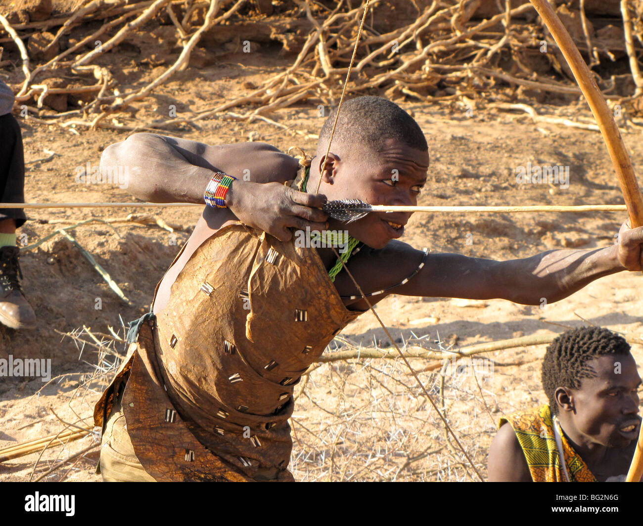 Africa, Tanzania, Lake Eyasi, Hadza hunters with bow and arrow. Hadza ...