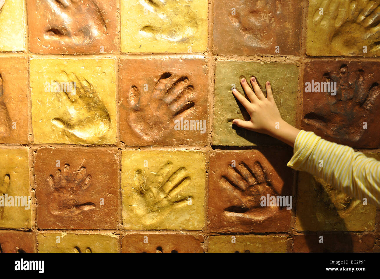 Hand fitting into cast in the shape of a hand Stock Photo - Alamy