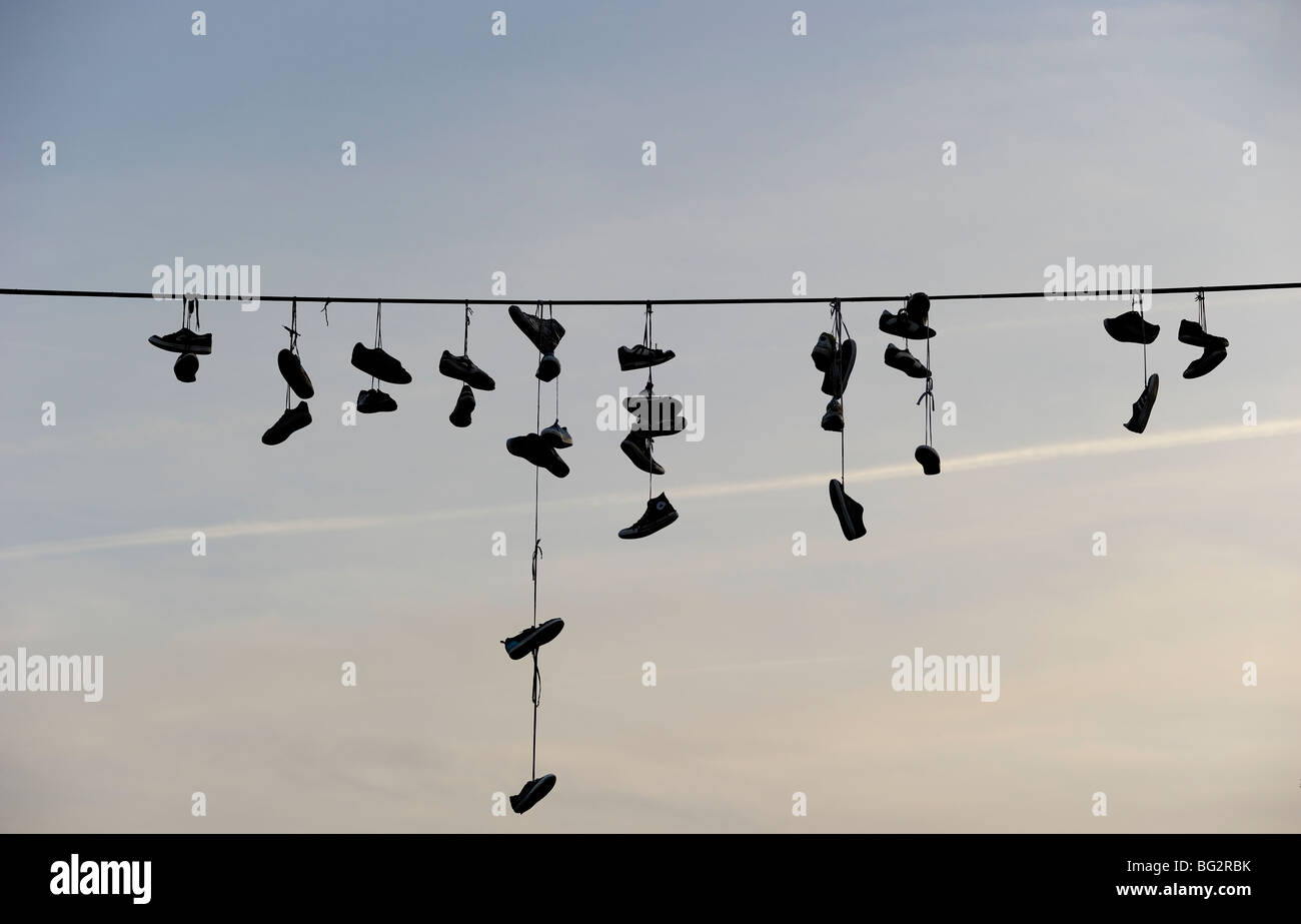 Trainers hanging from street cable hi-res stock photography and images ...