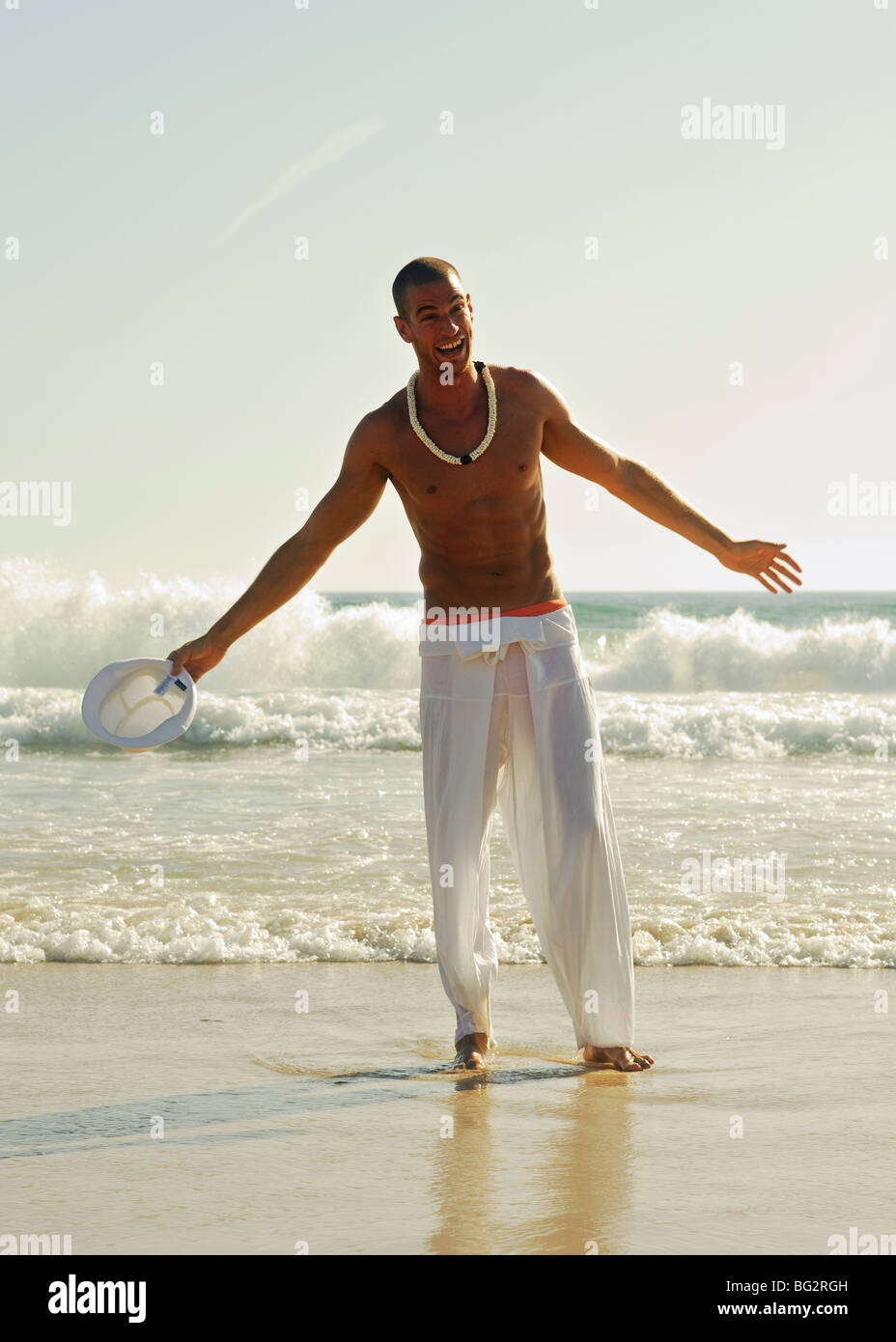 Man on the beach Stock Photo - Alamy