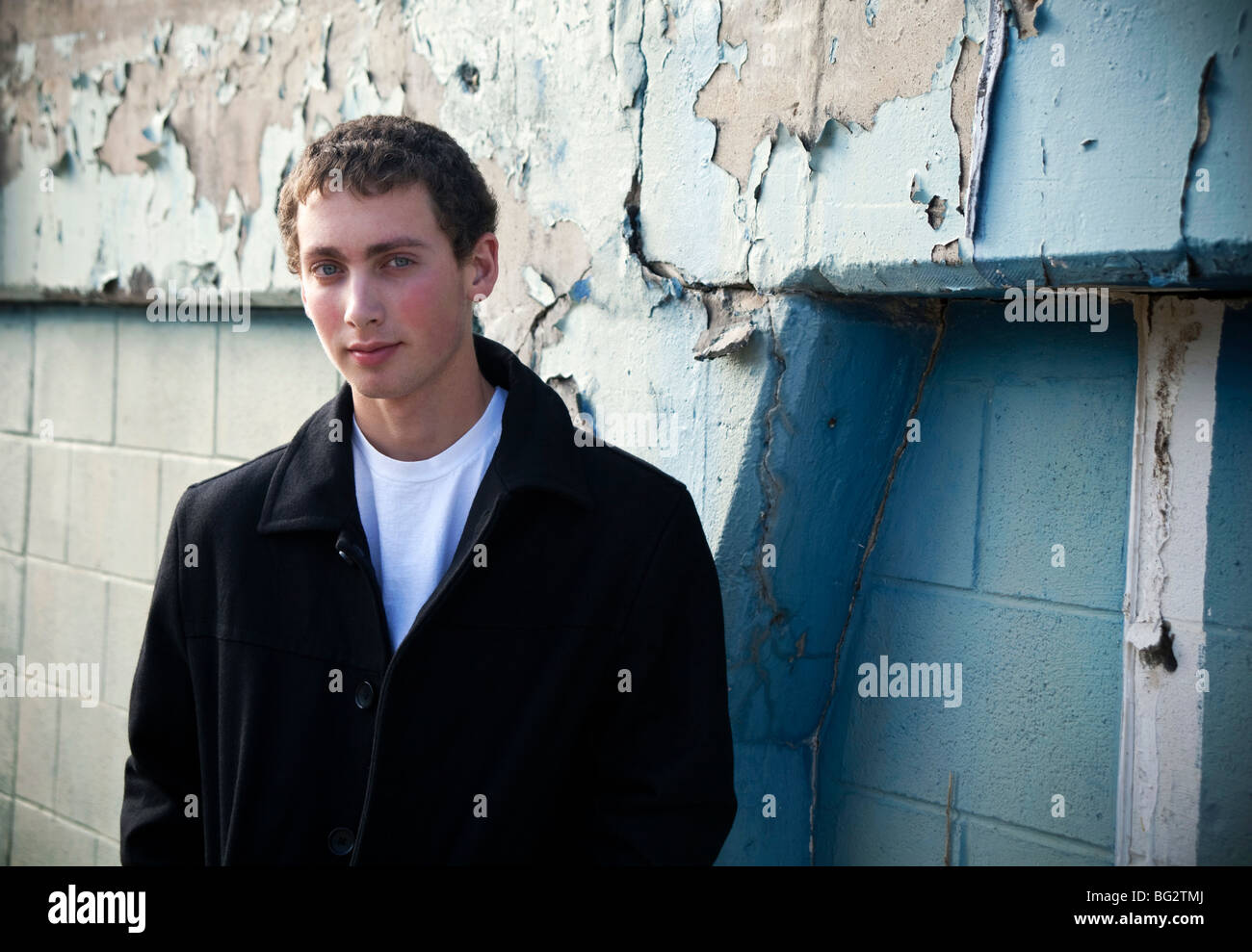 Handsome boy with an urban background Stock Photo - Alamy