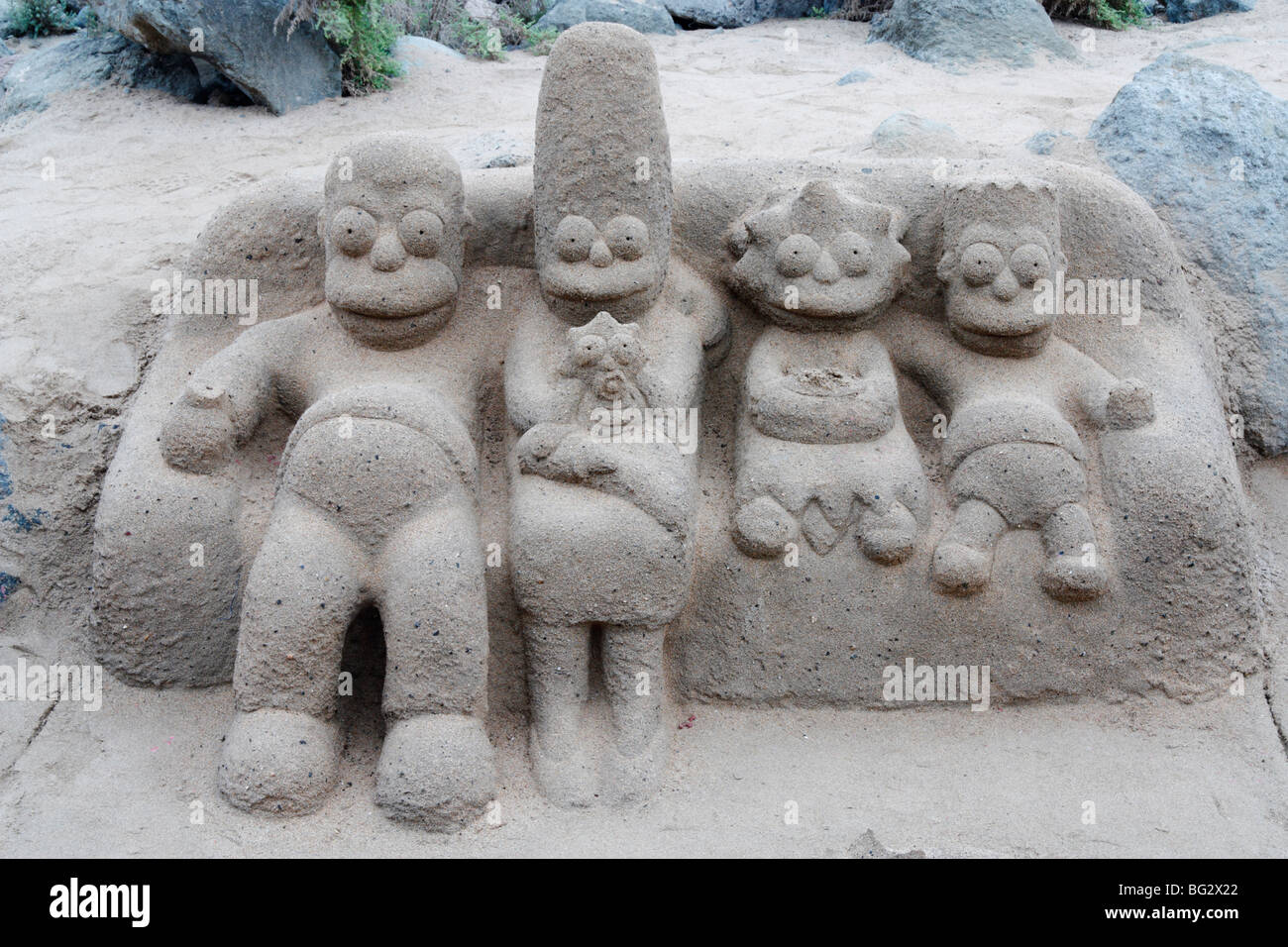 Sand sculpture of The Simpsons on beach in Spain Stock Photo - Alamy
