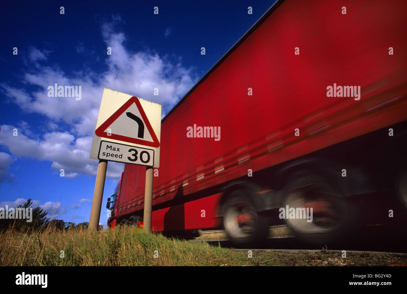 lorry passing warning sign of 30 mph speed limit and sharp left hand ...