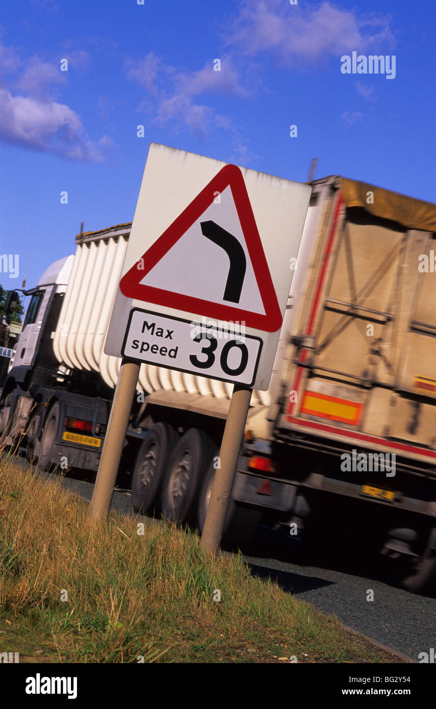 lorry passing warning sign of 30 mph speed limit and sharp left hand ...