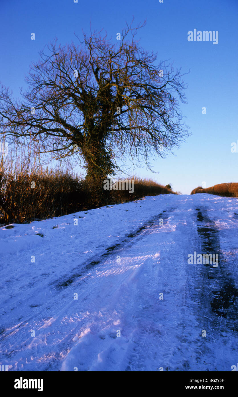 country road covered in deep snow in wintertime Yorkshire UK Stock ...
