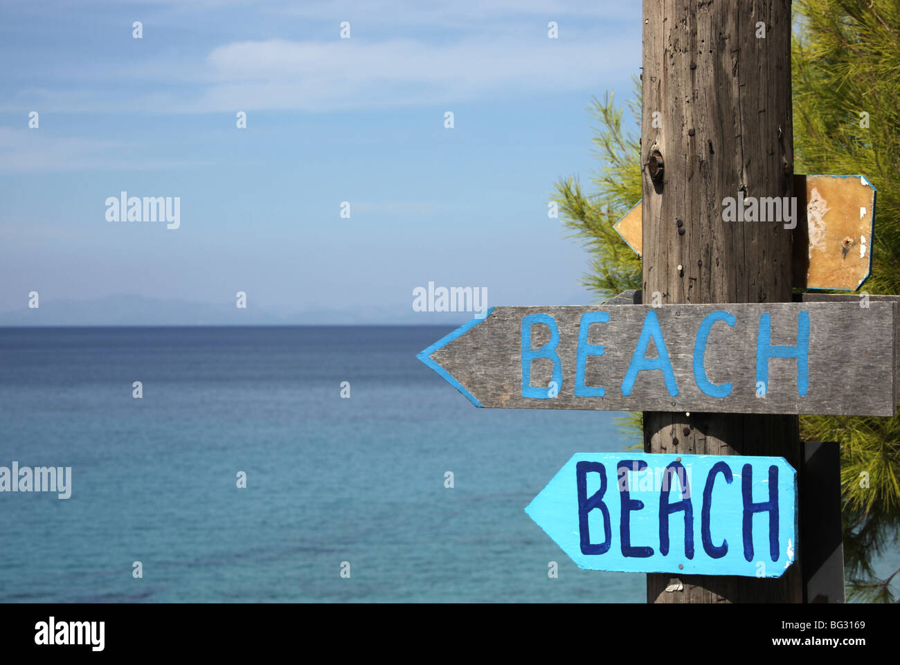 Two hand painted wooden signs pointing to the beach Stock Photo - Alamy