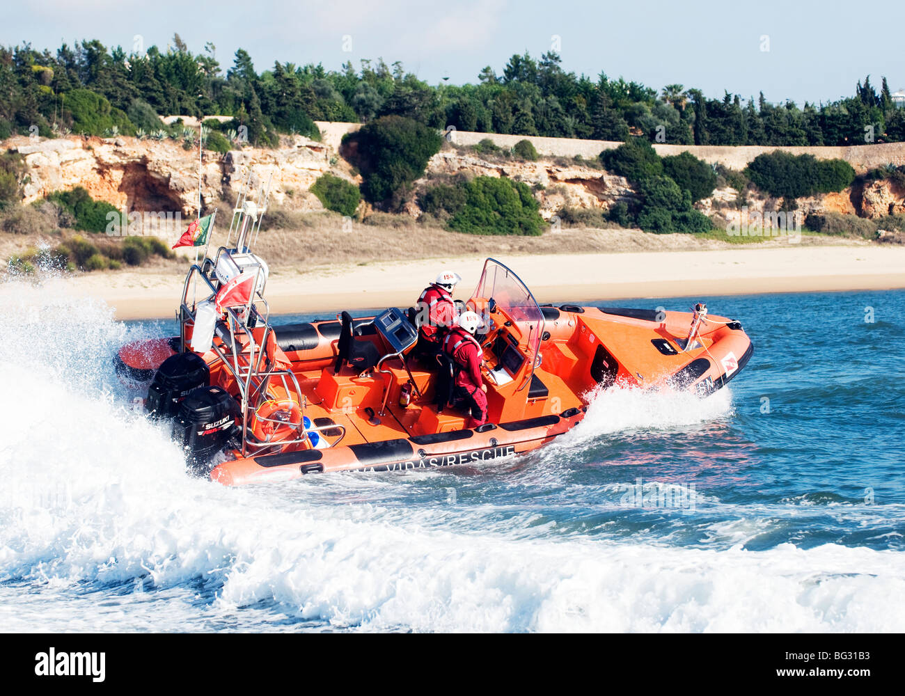 Members of the Portuguese inshore rescue service at the controls of a ...
