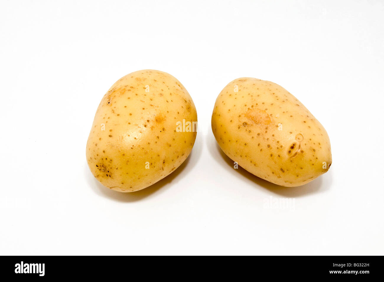 Two potatoes isolated on white background Stock Photo - Alamy
