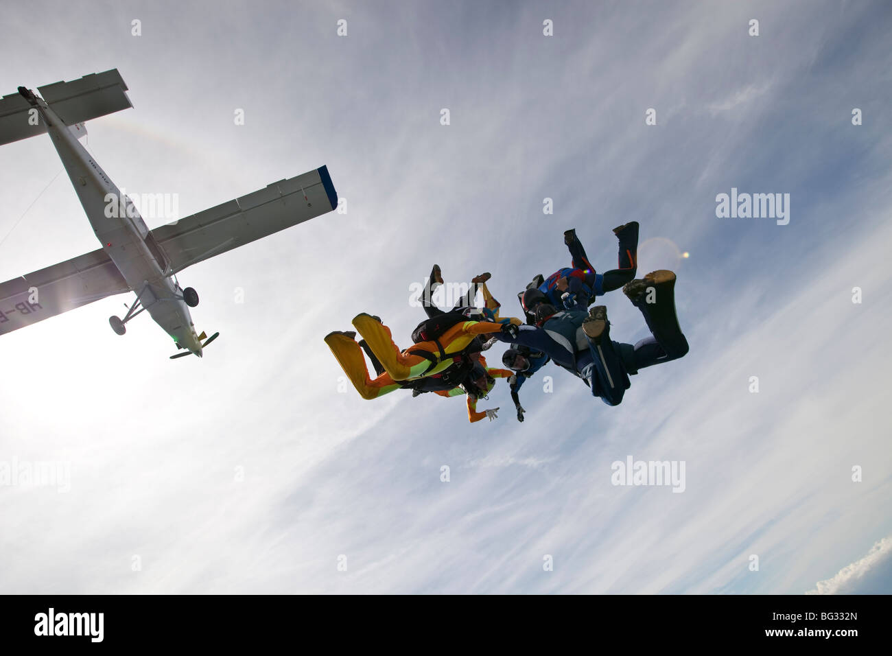 Skydiver team is flying a formation in the sky over a spectacularly ...