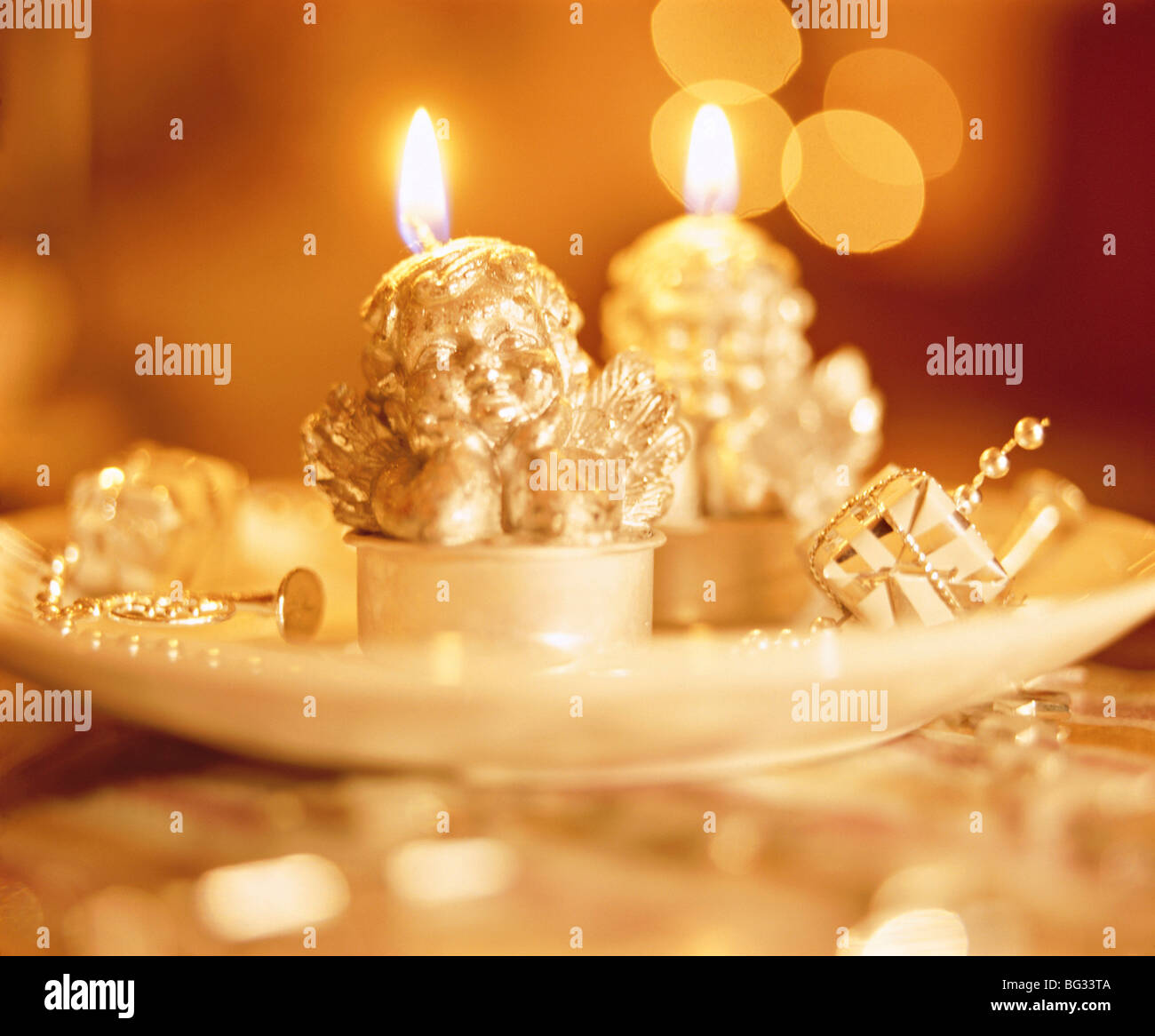 burning golden angel candles Stock Photo - Alamy