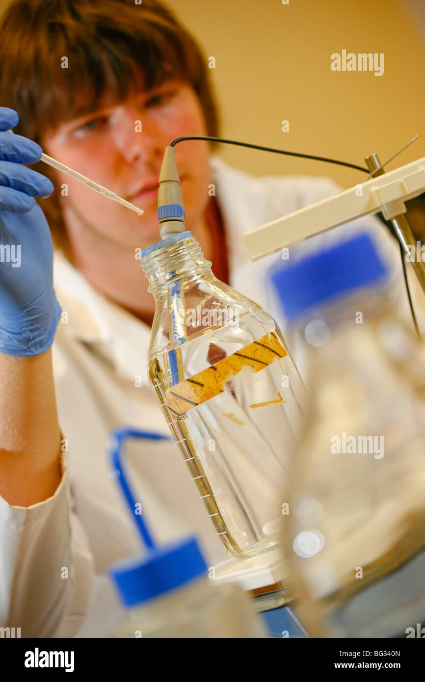 Male science research student in a laboratory testing Stock Photo - Alamy