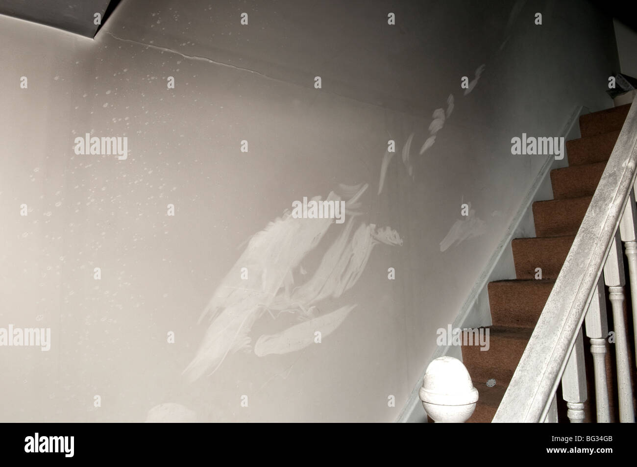 marks from BA shuffle search left in smoke damage on hall wall in a ...
