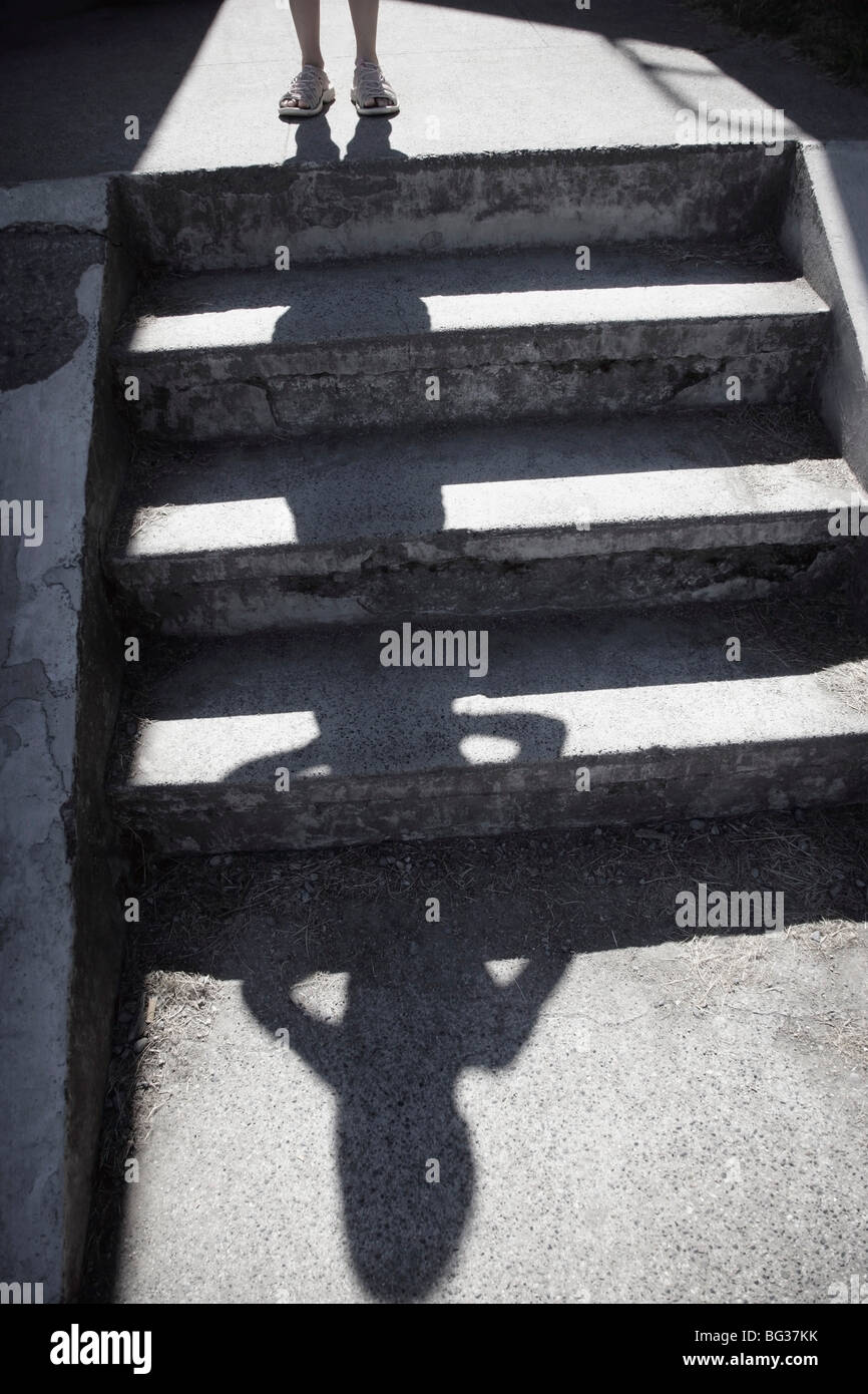 Shadow of person on stairs Stock Photo - Alamy