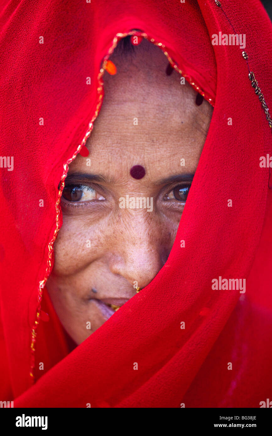 Covered face with red veil veiled woman hi-res stock photography and ...