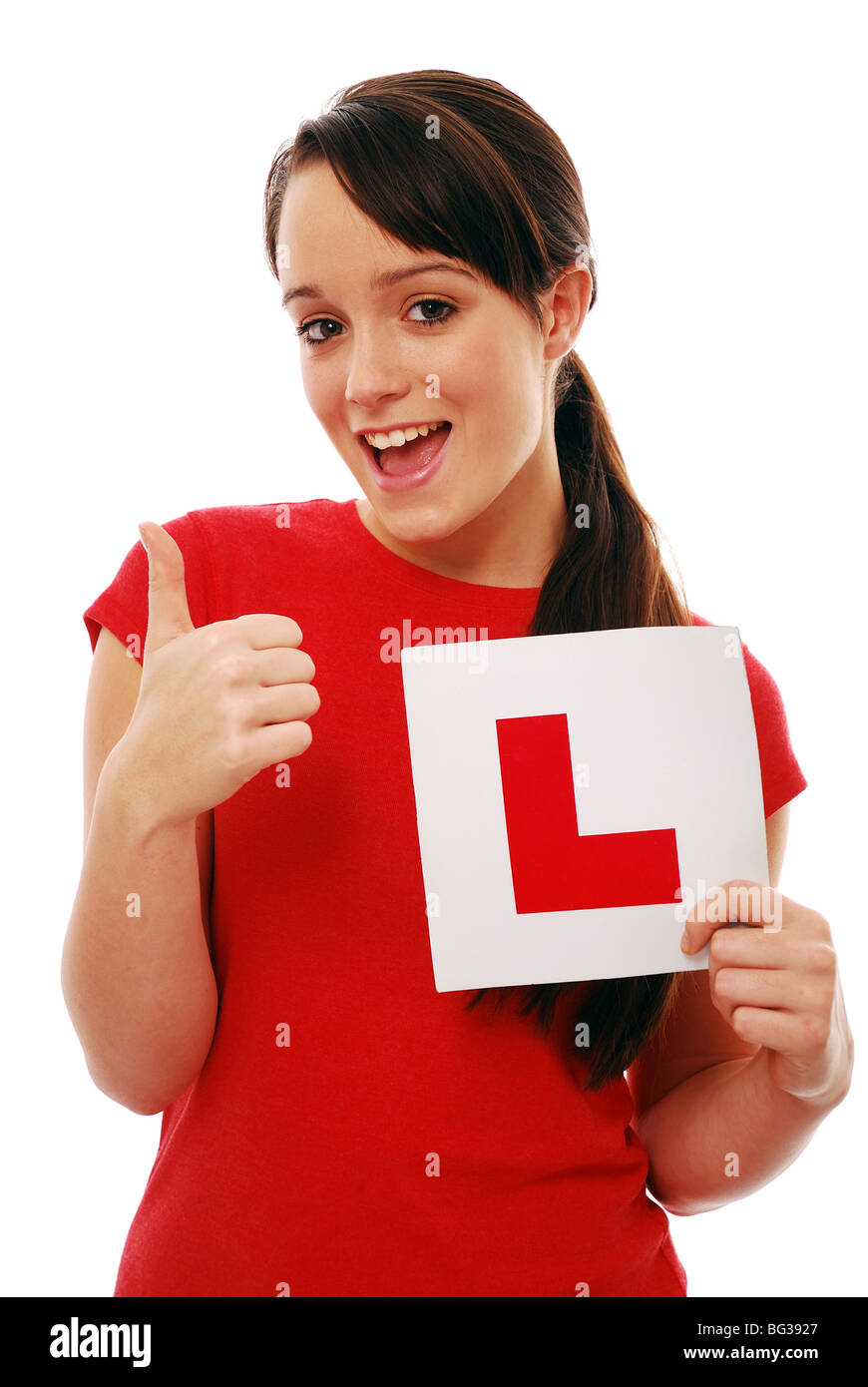 Young girl giving the thumbs up learner driver Stock Photo - Alamy