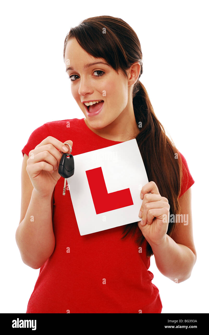 Young girl holding a car key and learner L plate sign Stock Photo - Alamy