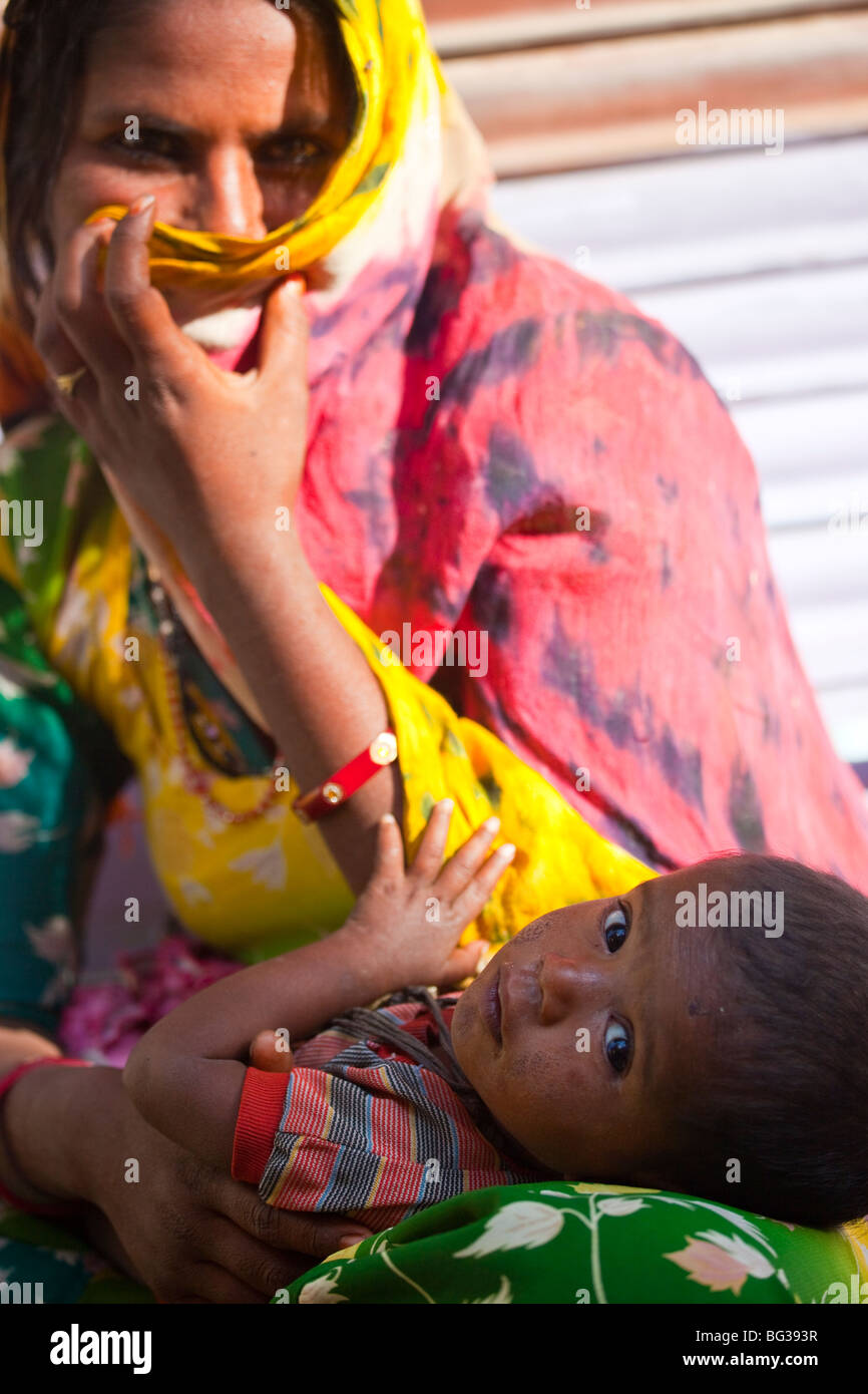 Begging woman and baby in Pushkar India Stock Photo - Alamy