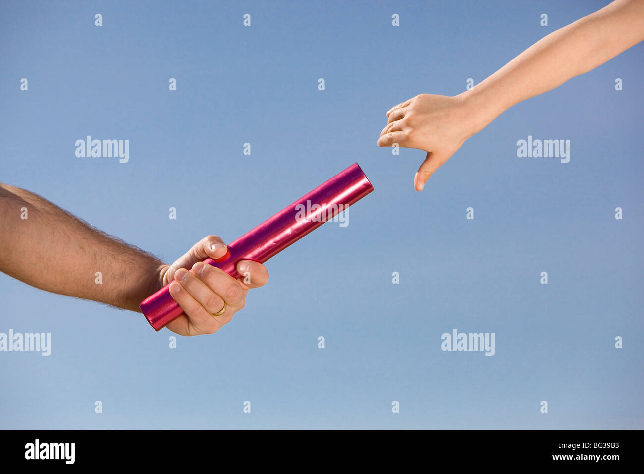 Father handing off a baton to his son Stock Photo - Alamy