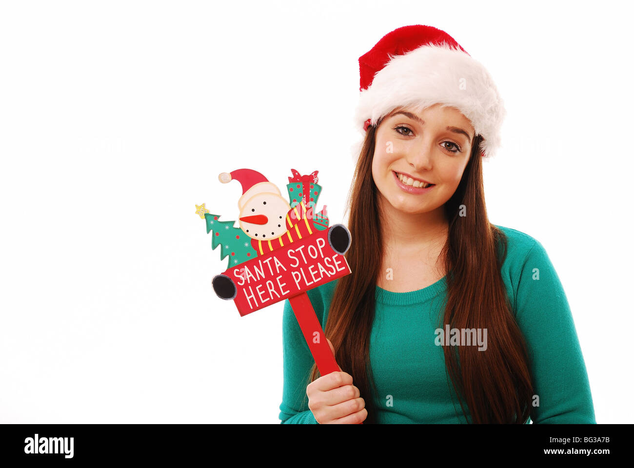 Young woman holding a stop here Santa please sign Stock Photo - Alamy