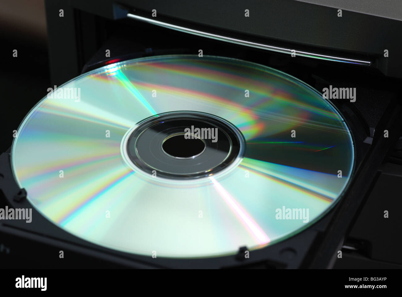 Disk in the drive. A photo close up CD of a disk Stock Photo - Alamy