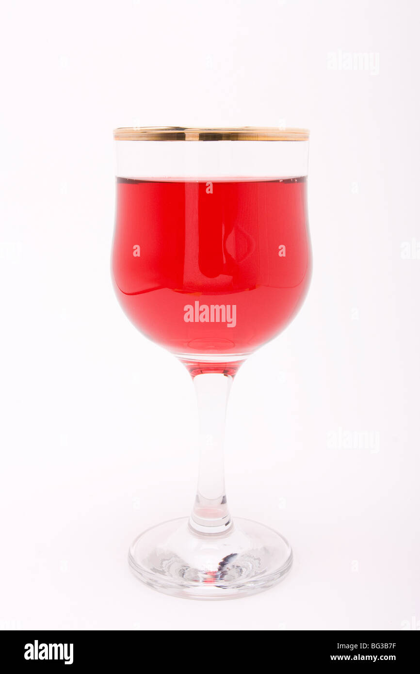 Glass of red Wine with gold rim isolated against white background Stock ...