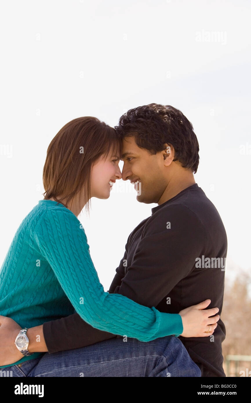 Young happy interracial couple in love Stock Photo - Alamy