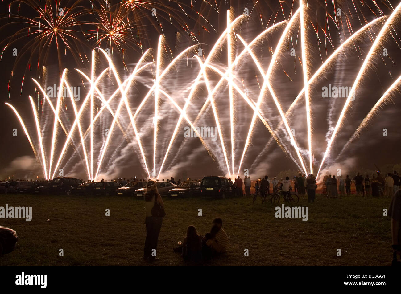 Bright fireworks exploding against a night sky Stock Photo - Alamy