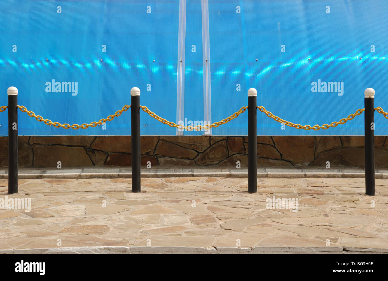 Fence from iron racks and a gold chain. A protection of the big hangar ...