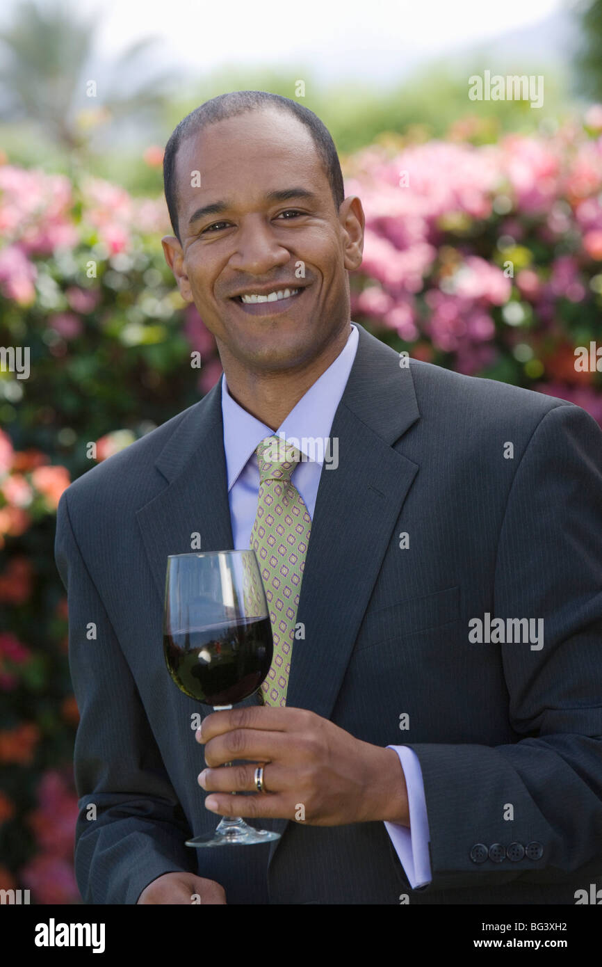 Middle-aged man with red wine Stock Photo - Alamy