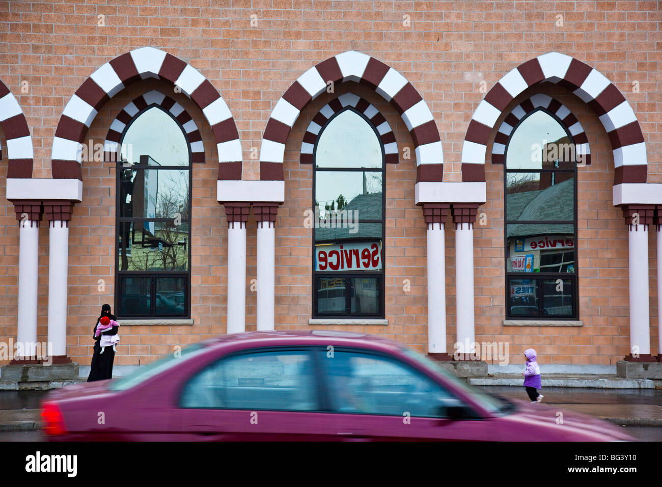 Muslim mother and children in front of Madina Masjid in Toronto Canada ...