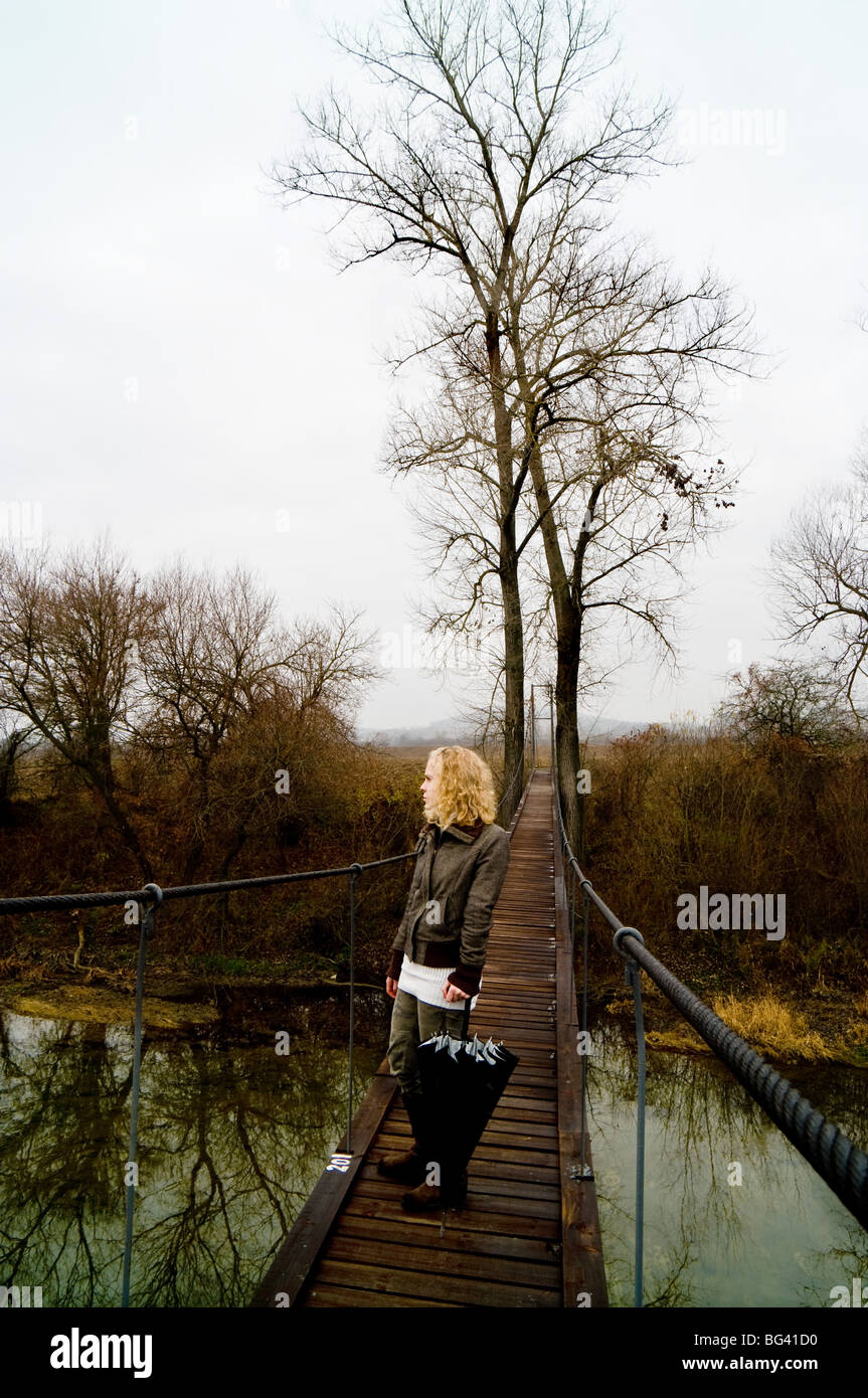 Girl on suspension bridge hi-res stock photography and images - Alamy