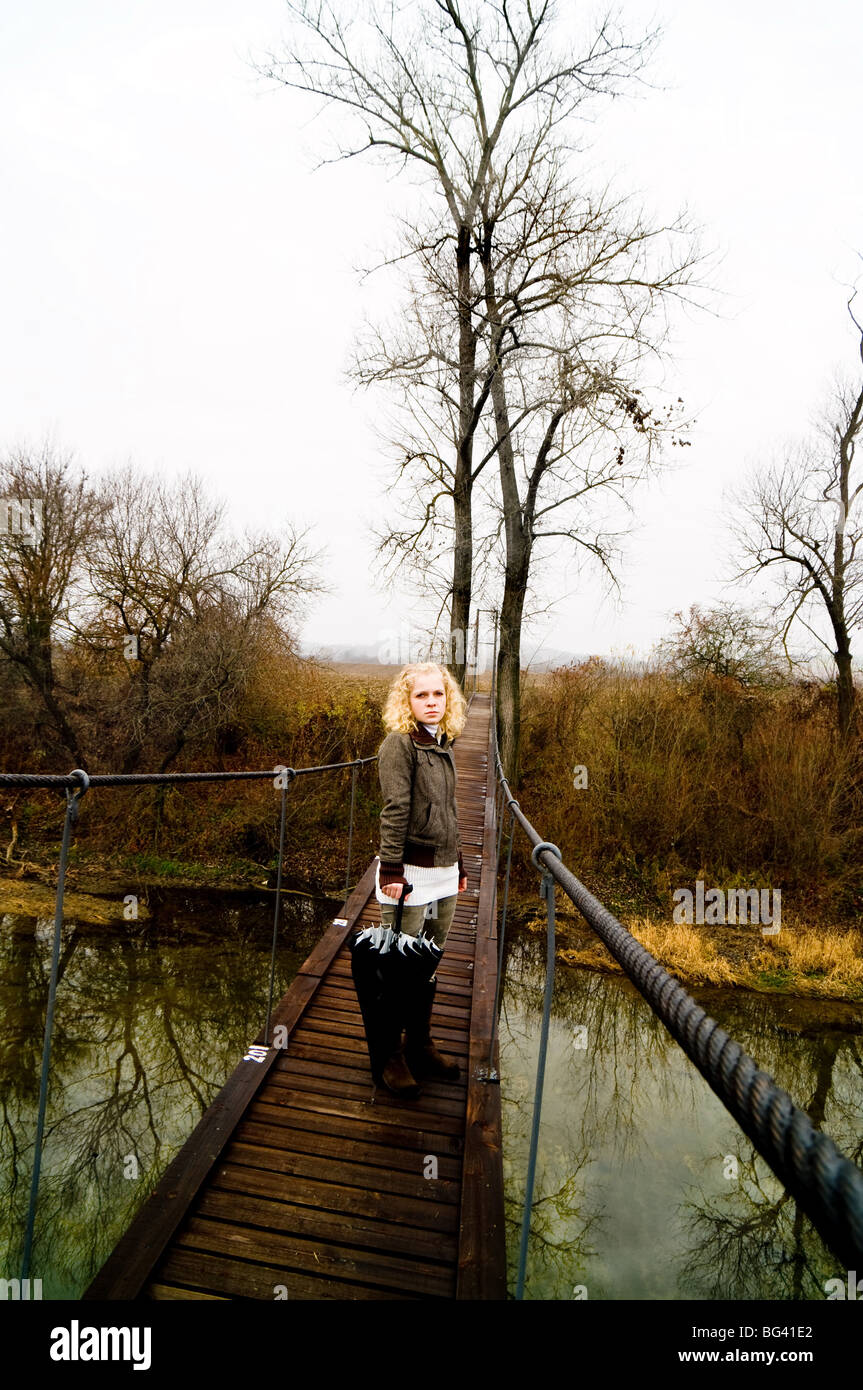 girl on suspension bridge Stock Photo - Alamy