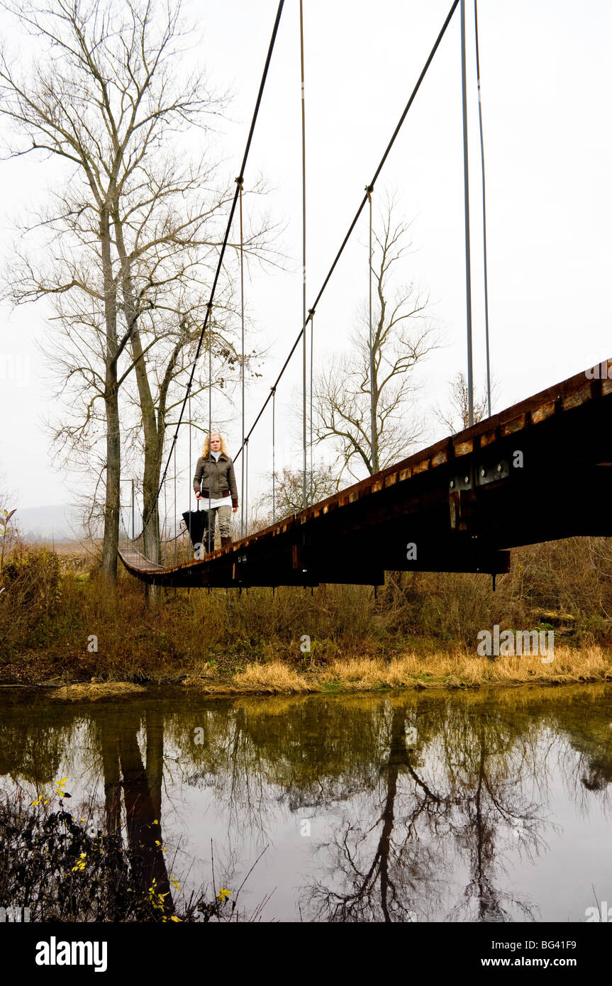 girl on suspension bridge Stock Photo - Alamy