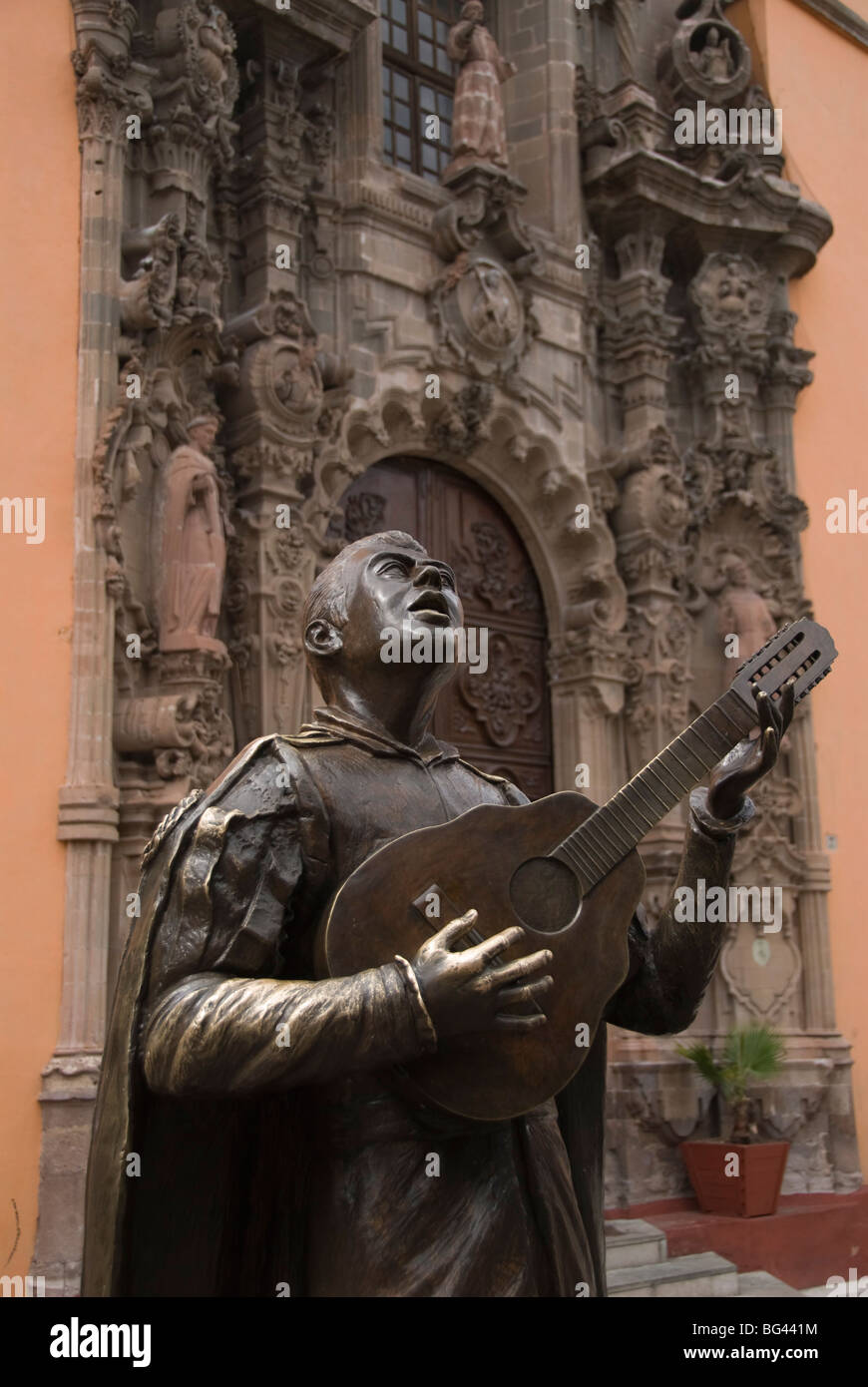 Bronze statue of a singing Mexican, in front of the Temple of San Diego ...