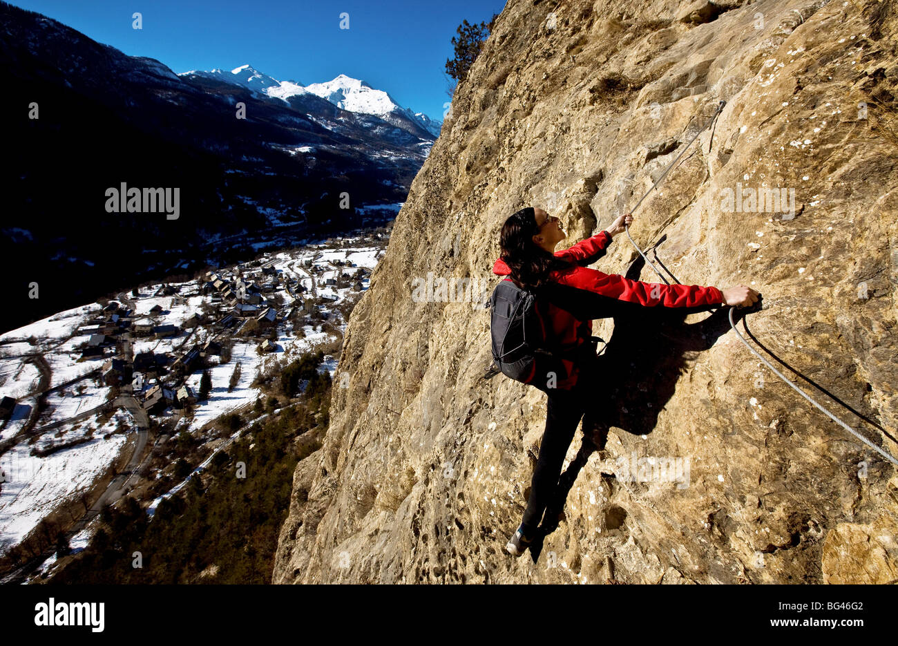 Climbing a via ferrata course near Vallouise, Ecrins Massif, France ...