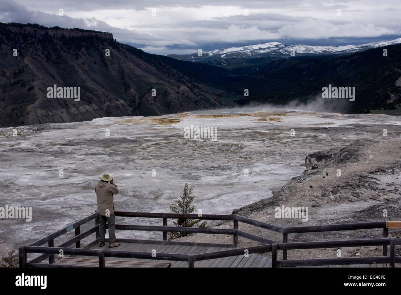 Tourist viewing geysers, Yellowstone National Park, UNESCO World ...