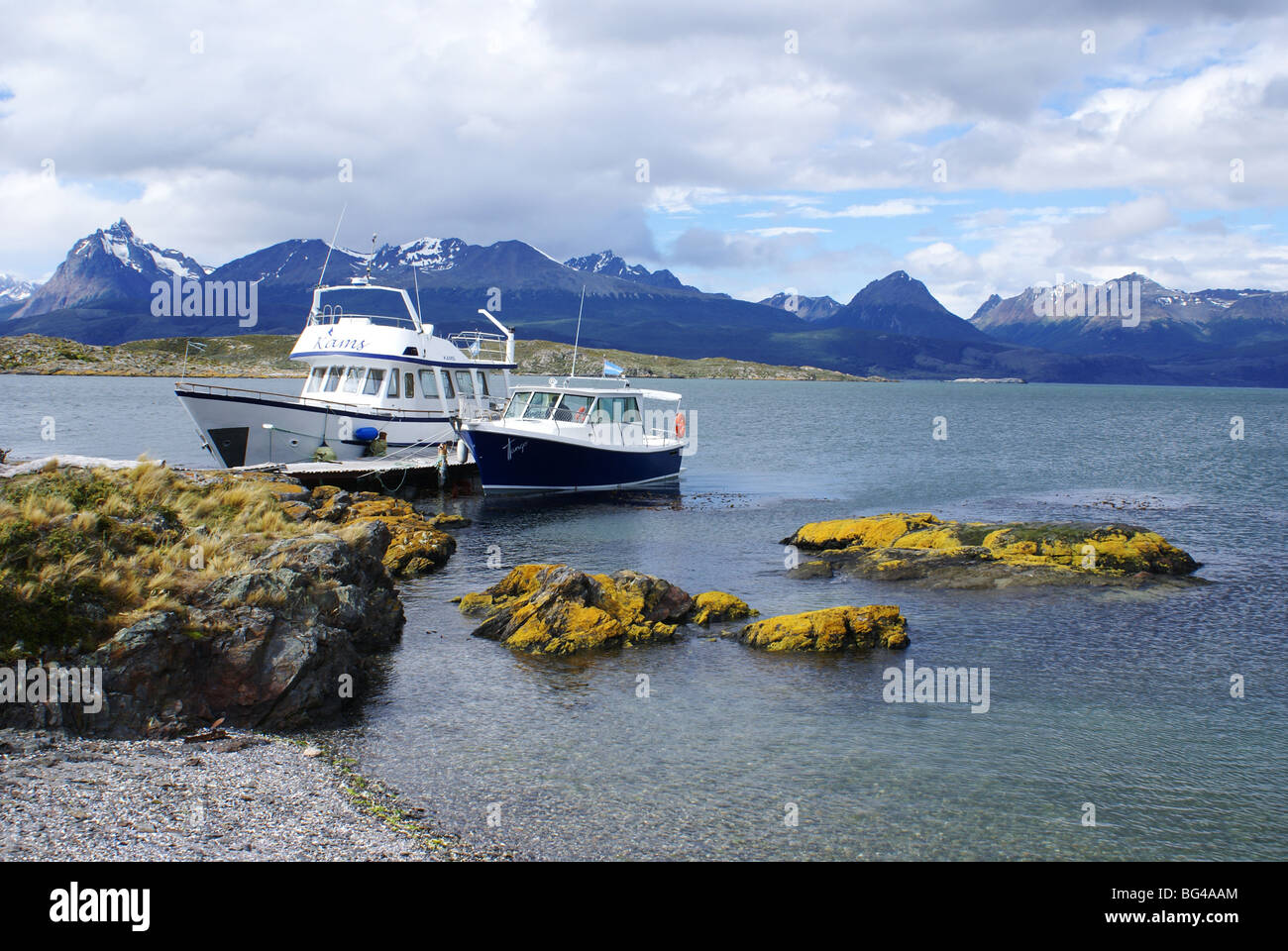Boats docked at a small island in the Beagle Channel. Ushuaia, Tierra ...