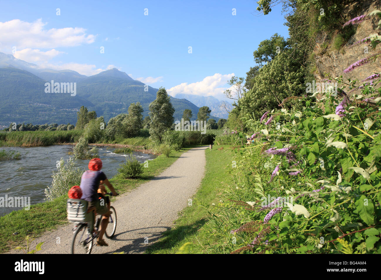 Family riding bicycle in Colico, Lake Como, Italian Lakes, Lombardy ...