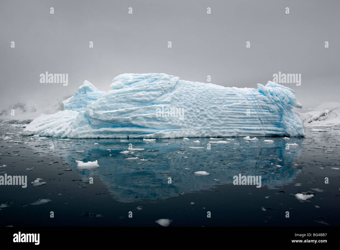 Iceberg with reflections in Paradise Bay, Antarctica Stock Photo - Alamy