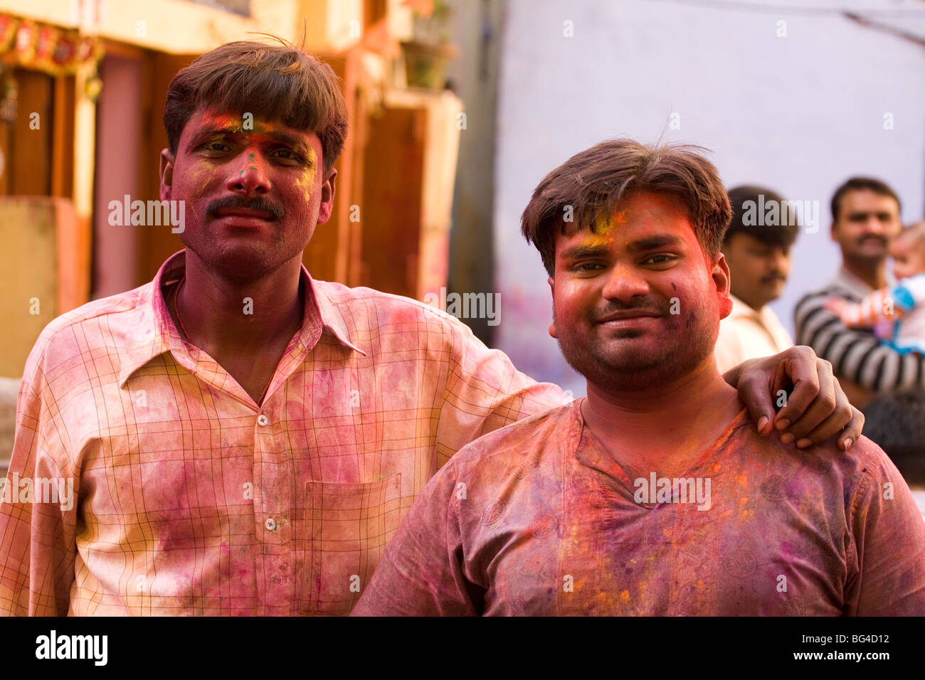 Indian men enjoy Holi in the Paharganj area of Delhi. Holi is often ...