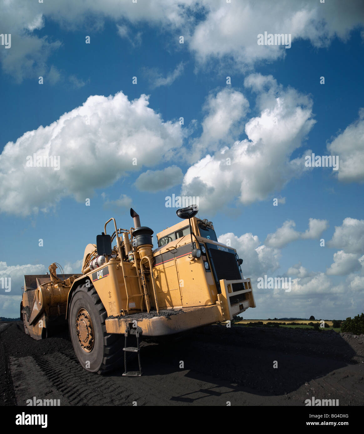 Earth-mover and grader machine on coal waste at power station, UK Stock ...