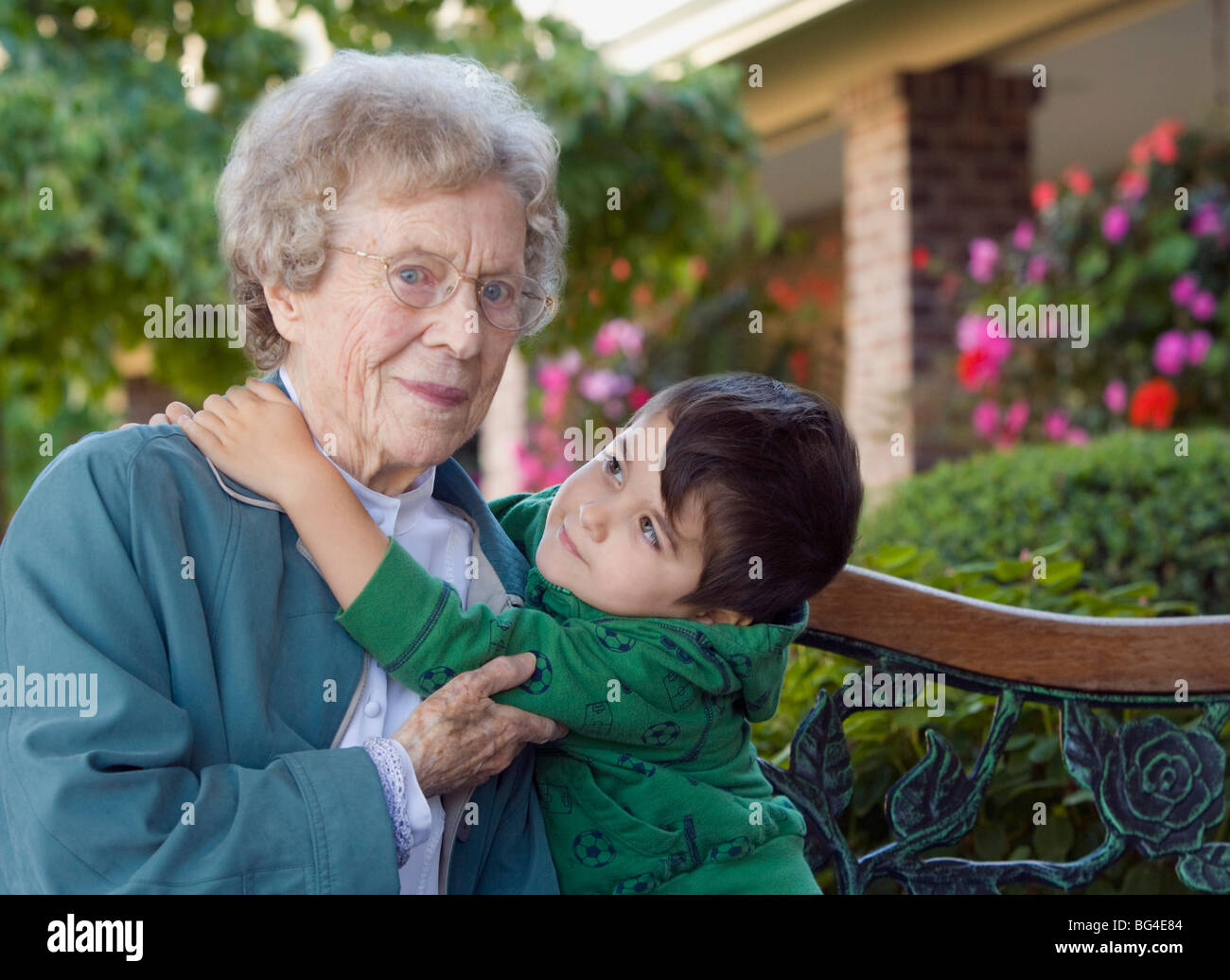 Outdoor portrait of grandmother and grandchild embracing Stock Photo ...