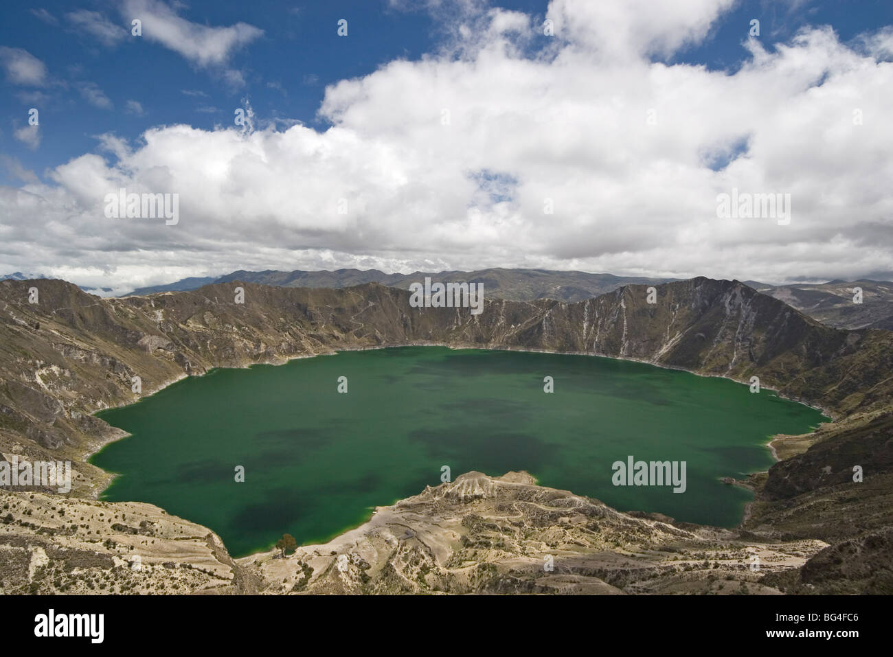 Laguna Quilatoa, volcanic crater with 250m deep green lake of alkaline ...