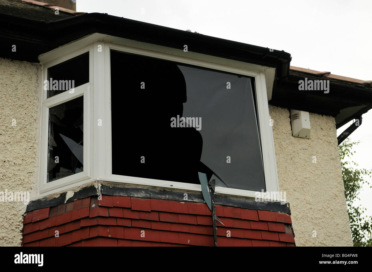 Burnt out bedroom from house fire with broken window Stock Photo - Alamy