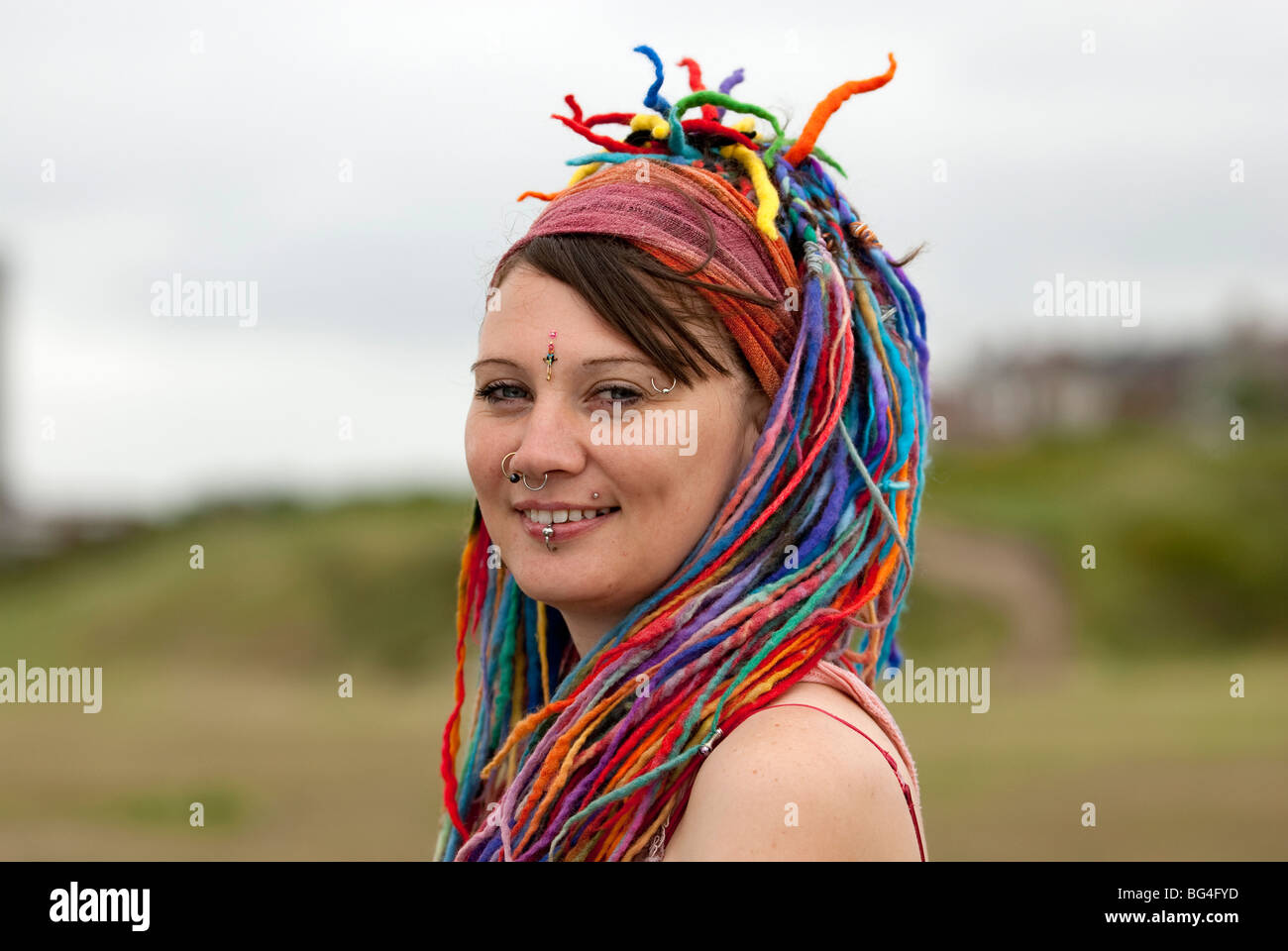 Lady Hippy with multi coloured hair smiling. FULLY MODEL RELEASED Stock ...