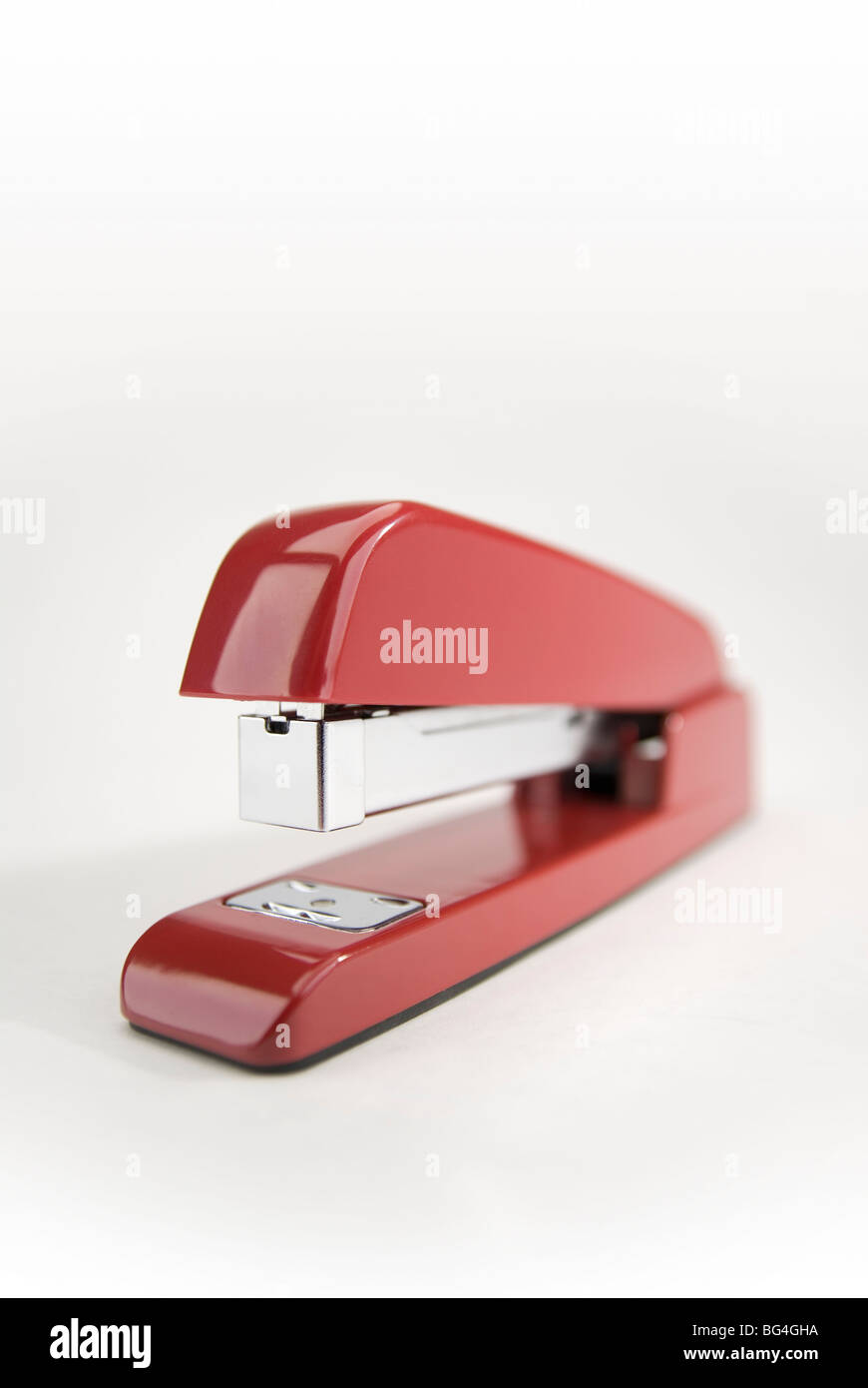Close-up image of a red stapler on a white background Stock Photo - Alamy