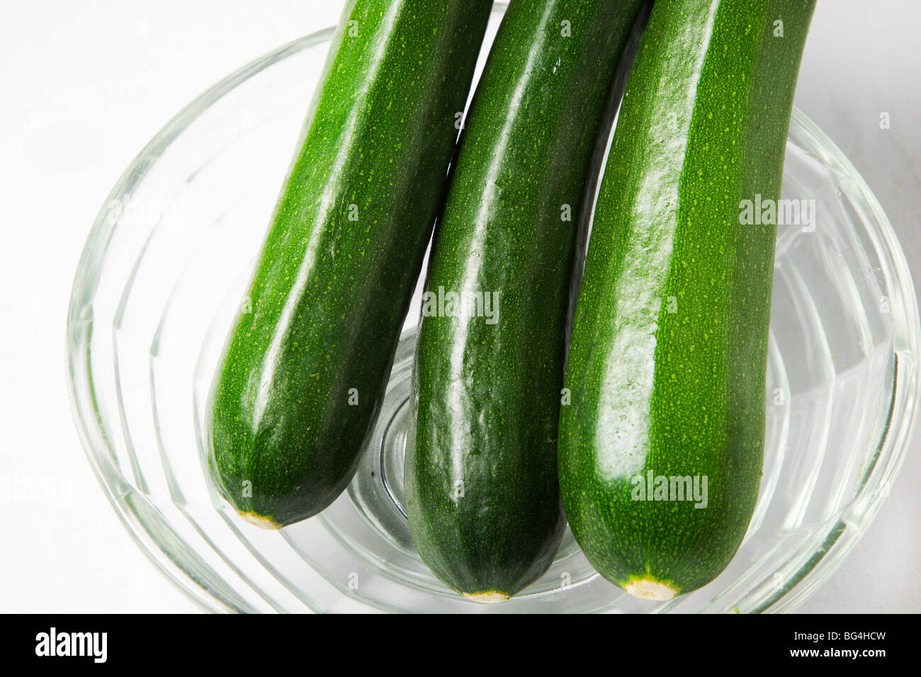 Three Courgettes in a Glass Bowl Stock Photo - Alamy