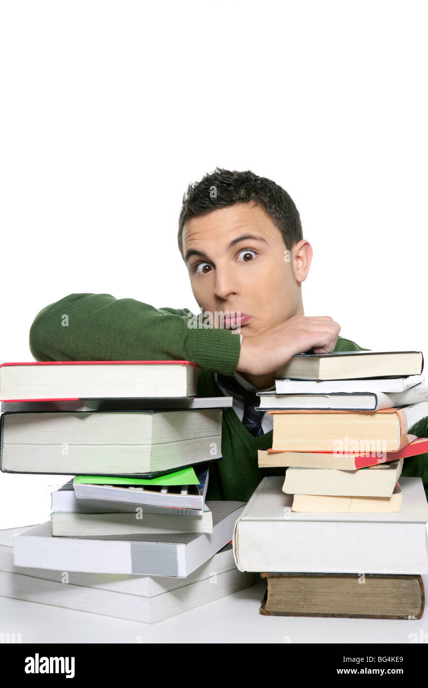 Young unhappy student with much homework and stacked books over white ...