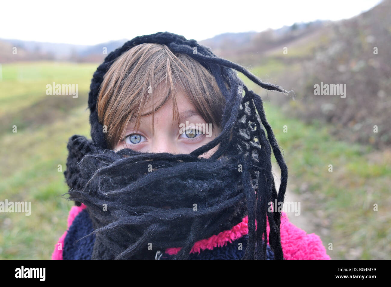 Girl with covered face Stock Photo - Alamy