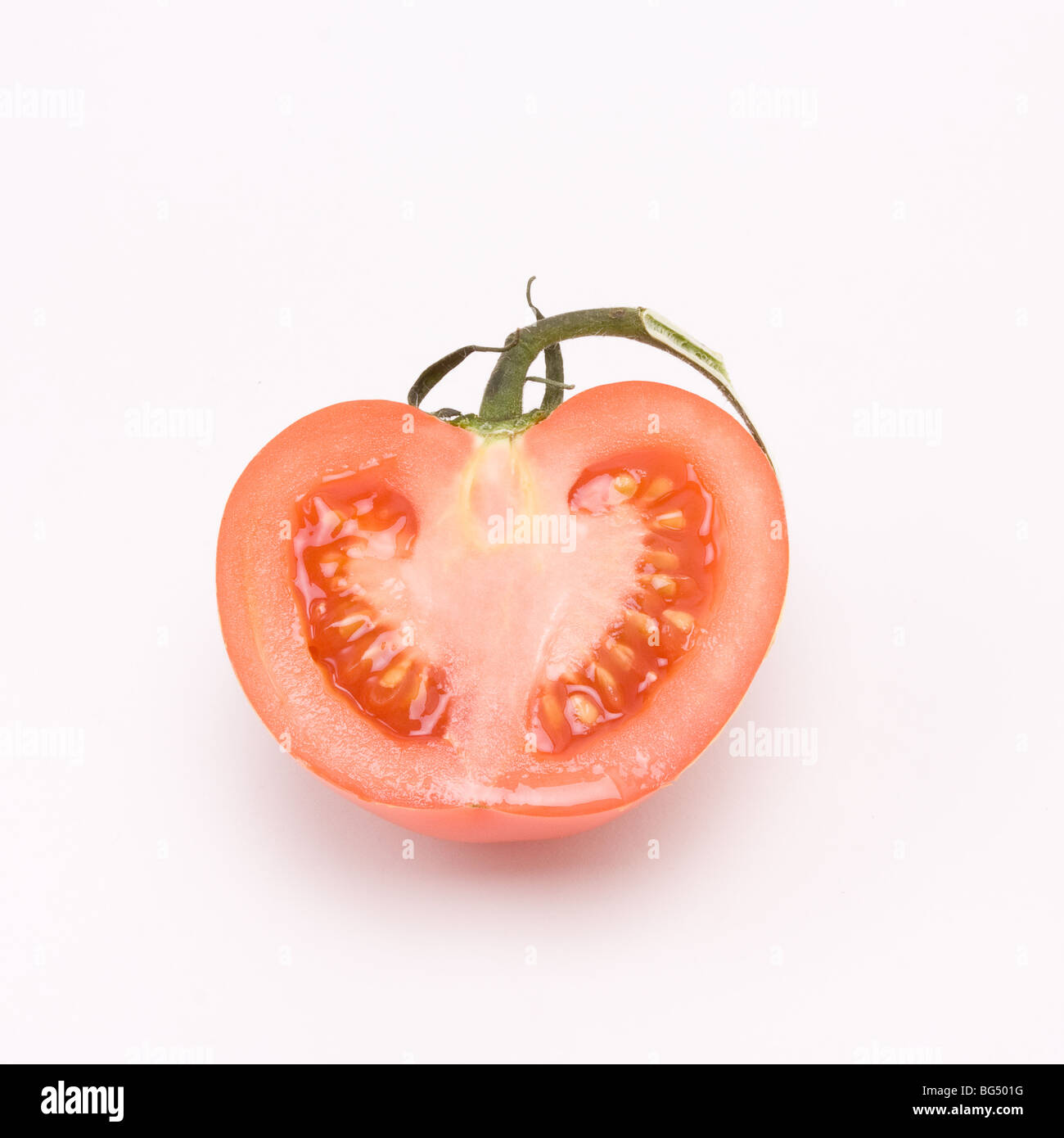 Sliced Beef Tomato isolated on white background Stock Photo - Alamy